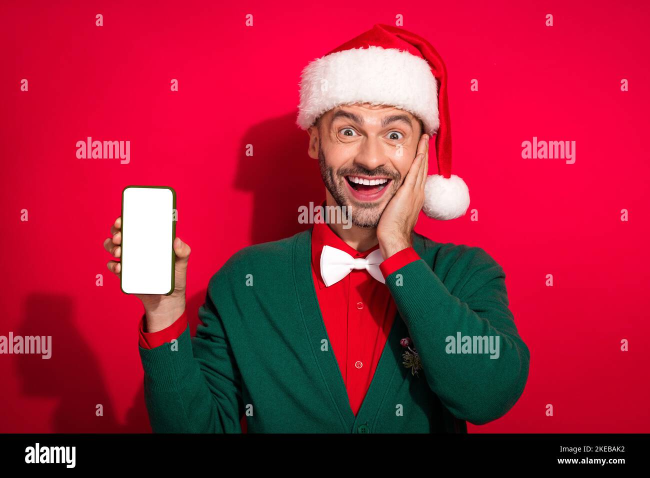 Photo Of Impressed Funny Guy Dressed Xmas Green Cardigan Bowtie Hand