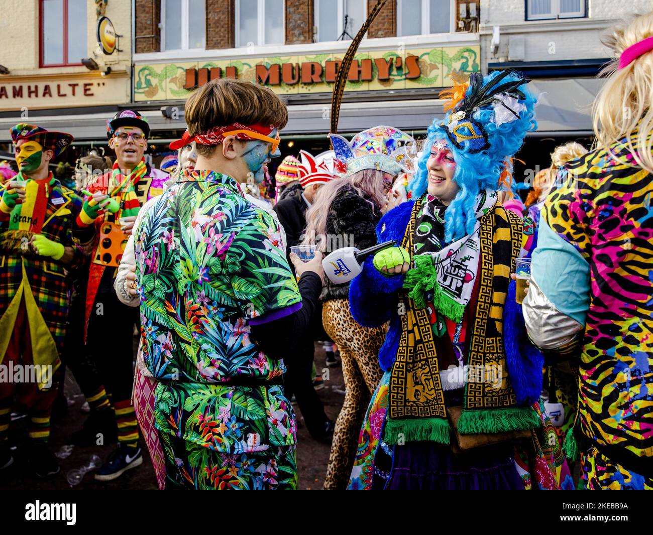 Revelers in traditional clothing during hi-res stock photography and ...