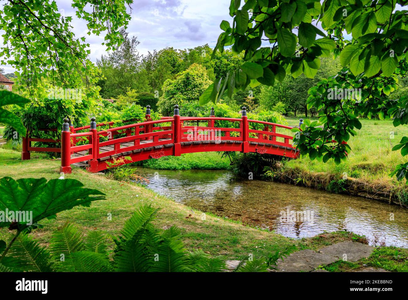 The wooden Japanese bridge over the River Avon in the garden at Heale ...