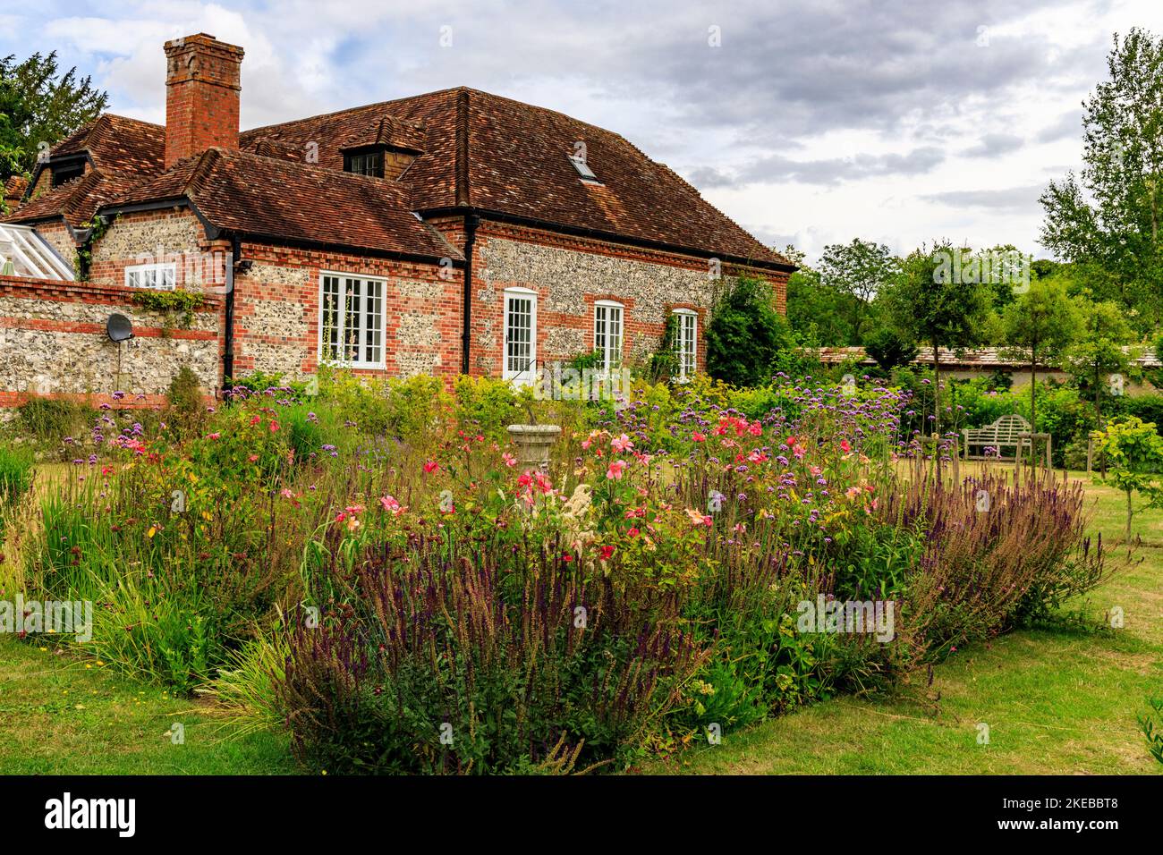Colourful flowers next to the stable block at Heale House - a 17th ...