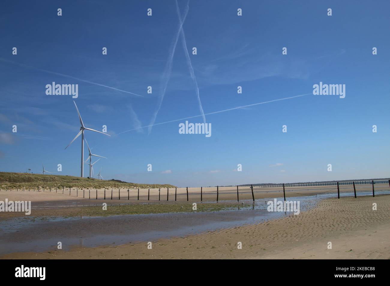 a Shot of tall windmills in a wind power plant Stock Photo - Alamy