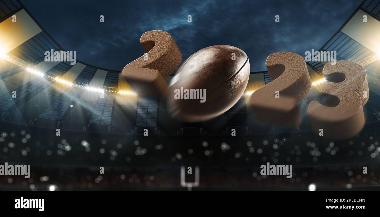 Flight of american football ball through dark evening stadium with ...