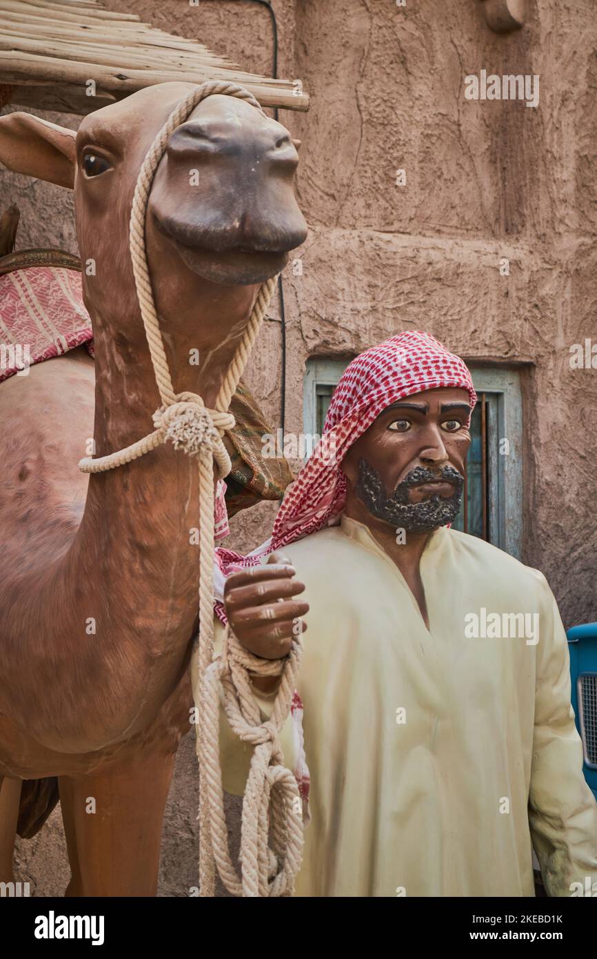 A statue of Emarati Man Hold his Camel at Al Seef Dubai UAE Stock Photo ...