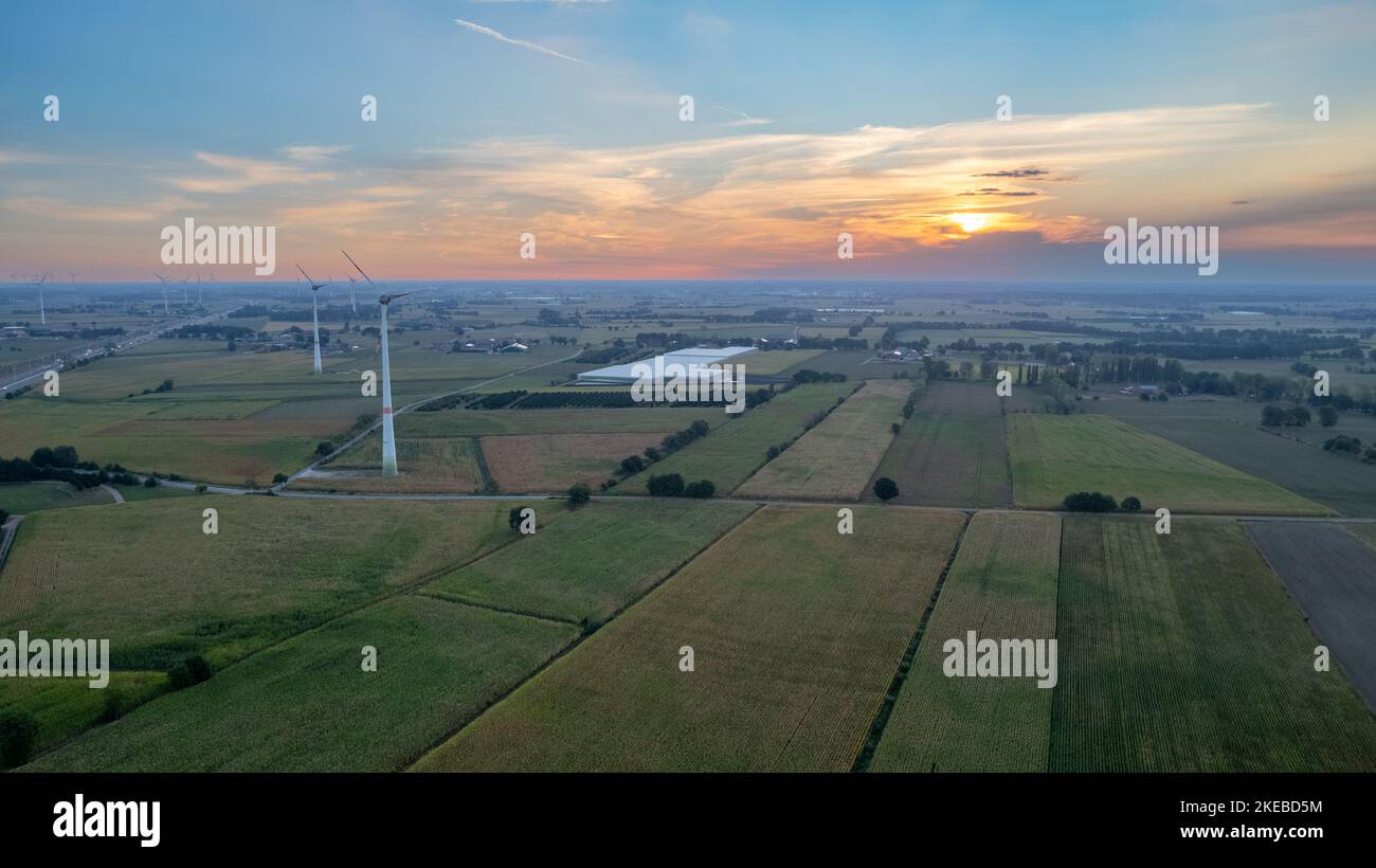 Beautiful wind turbine in the countryside in the time of sunset ...