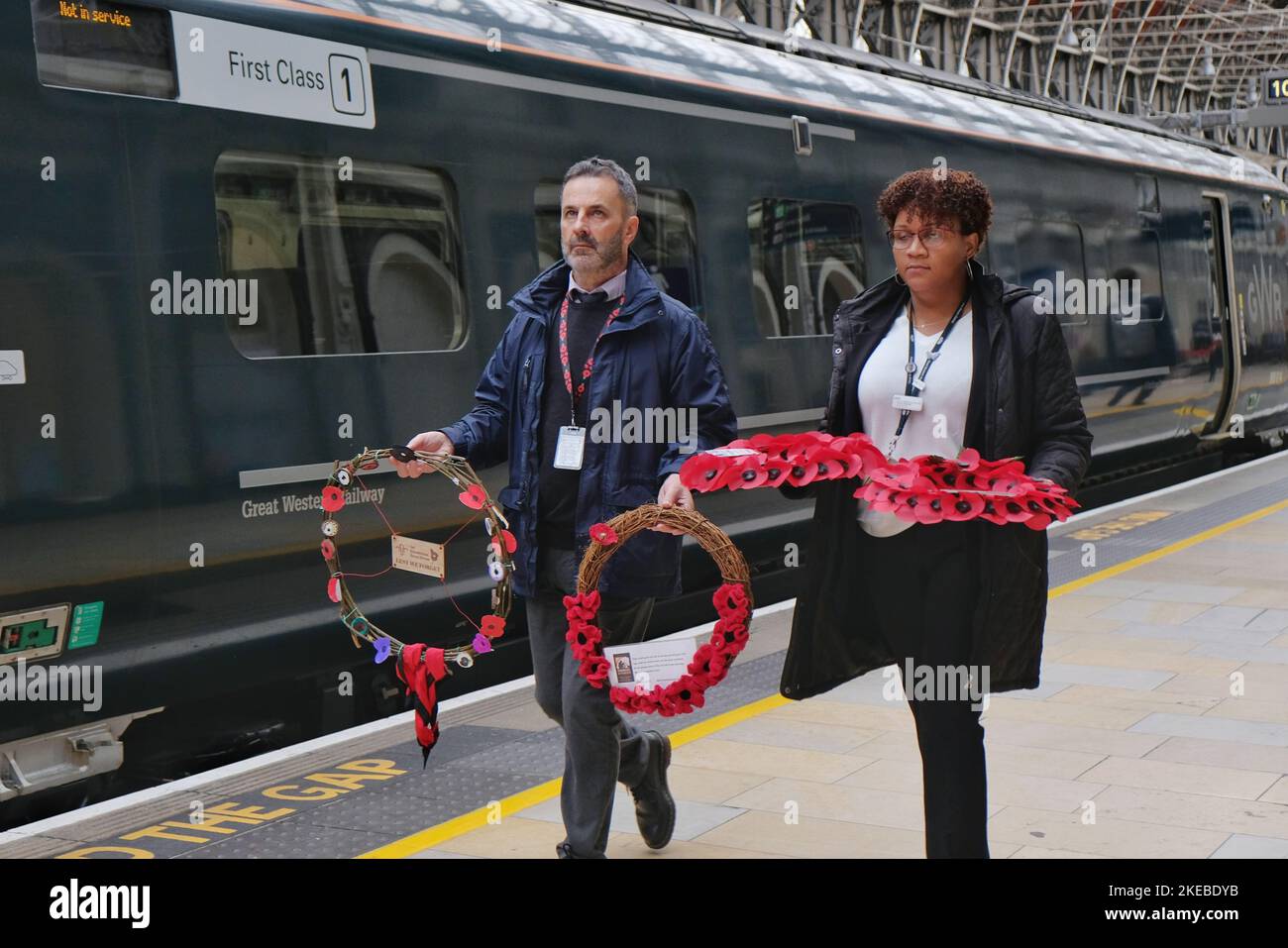 London, UK, 11th November, 2022. Station staff move poppy wreaths as ...