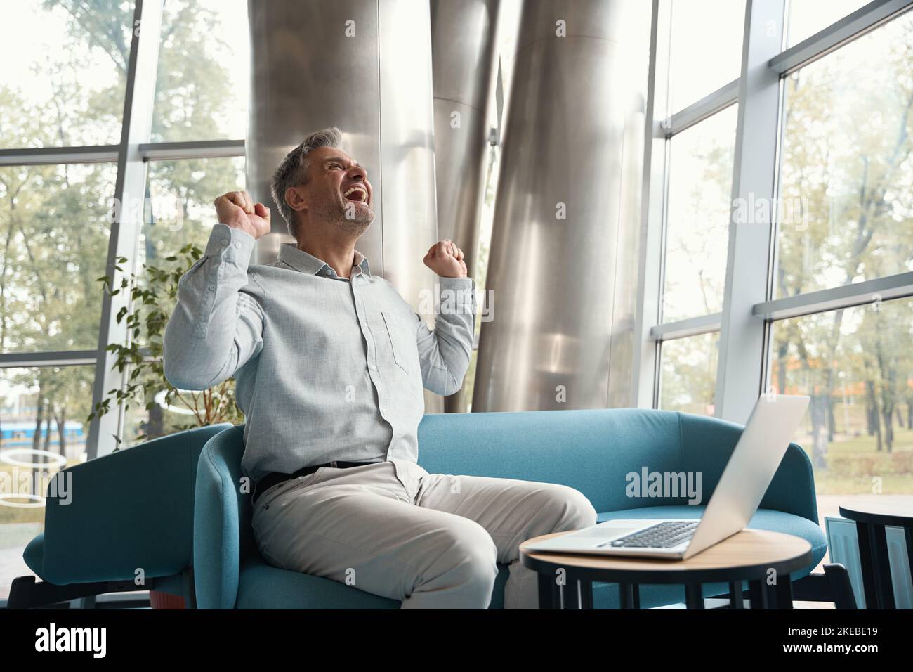 Employee of company happily reacts to victory of new project Stock ...