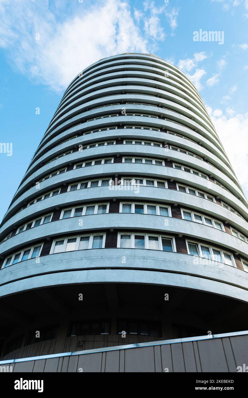 Modern architecture of a round building with concrete rings around the ...
