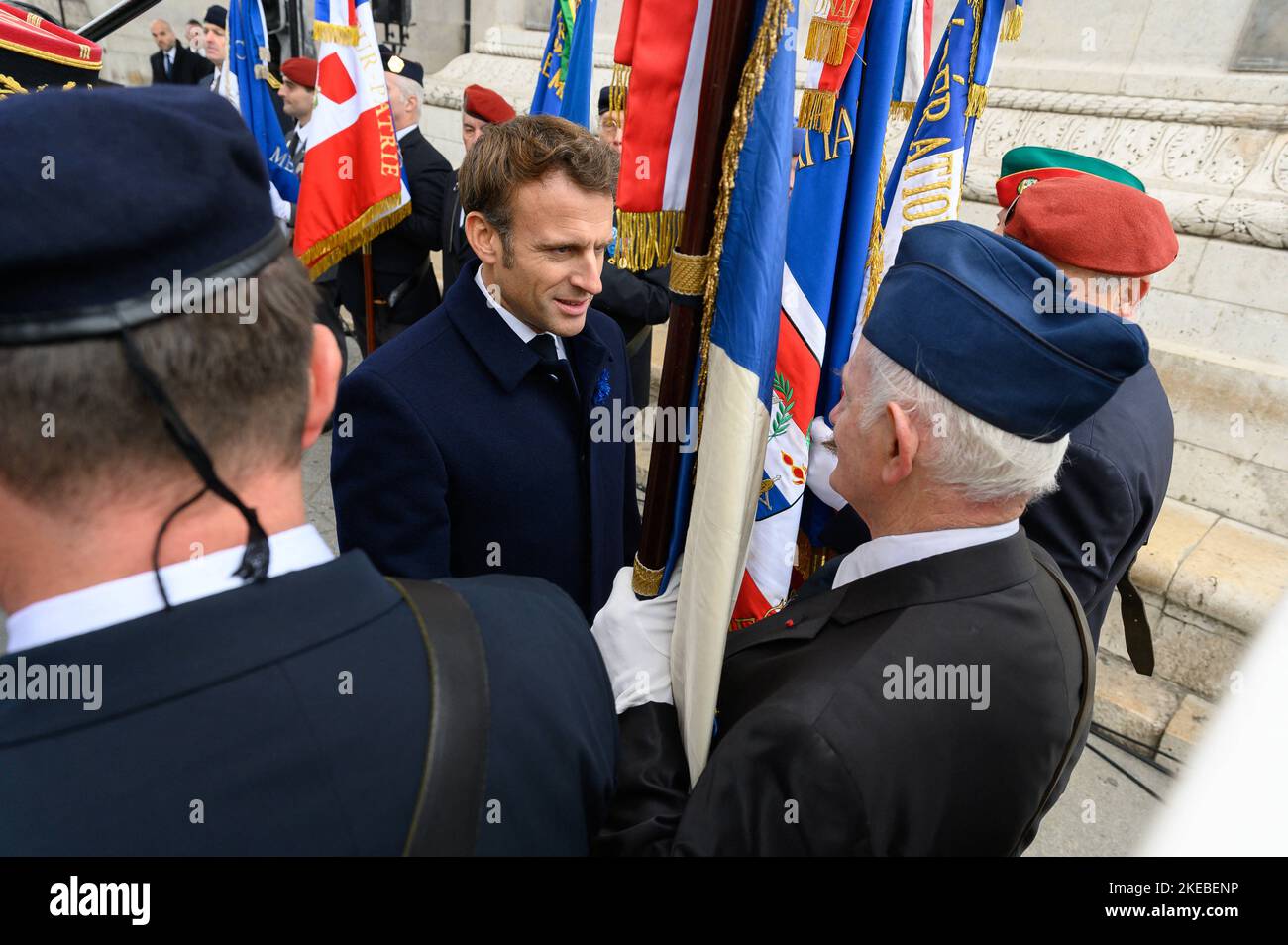 Emmanuel Macron shales hands with veterans. French President Emmanuel ...
