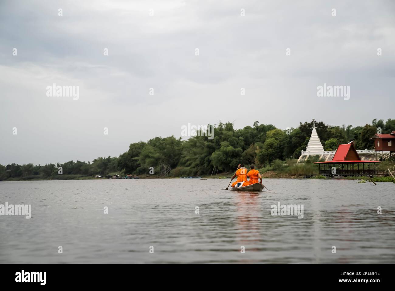 2 monks rowing along the river to receive alms in the morning Stock ...