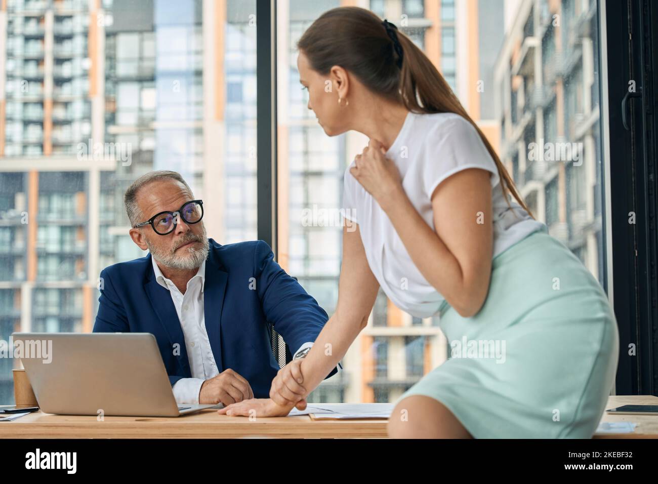 Young secretary flirting with boss at workplace Stock Photo - Alamy