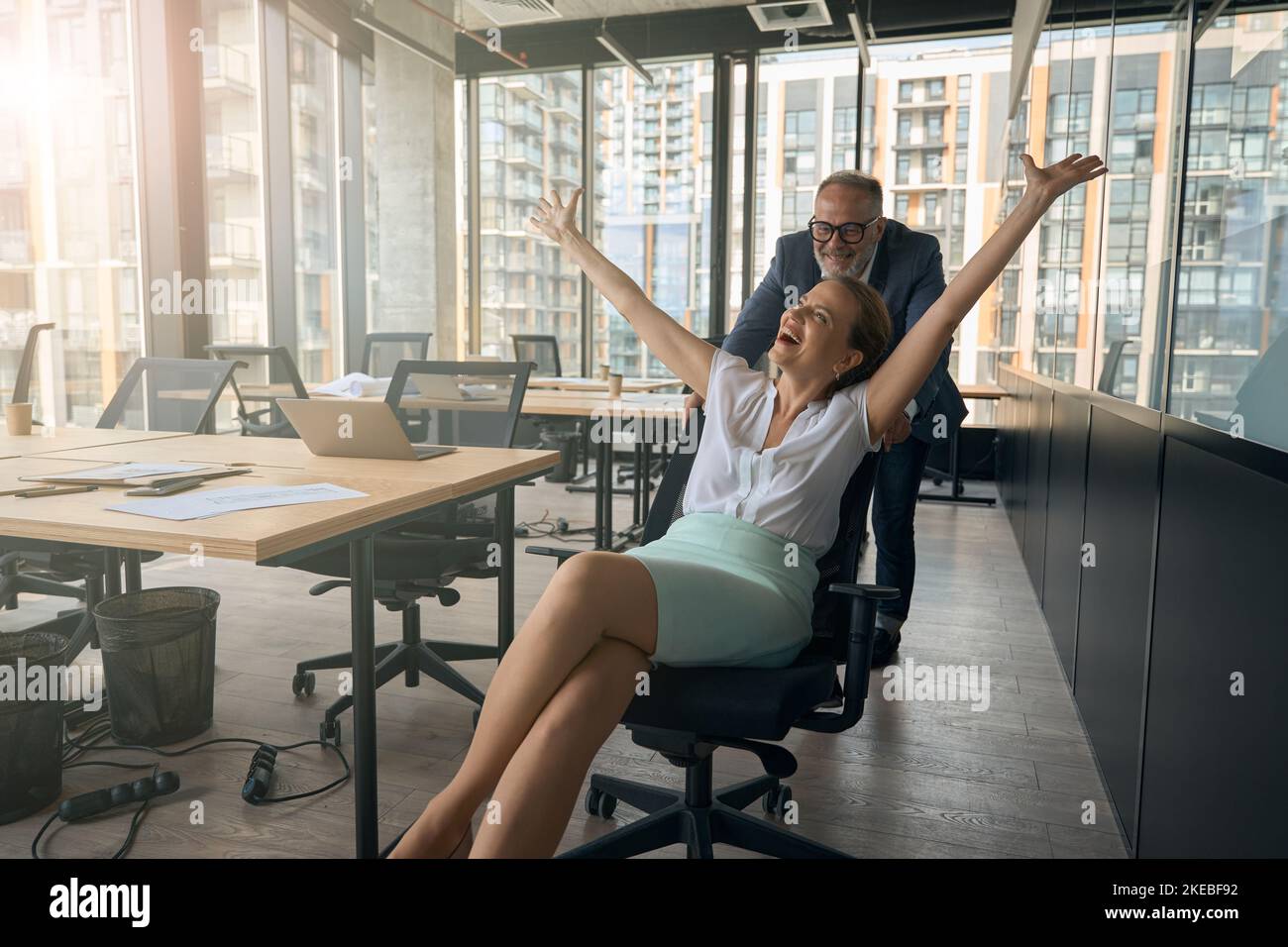 Happy office coworkers celebrating good deal at work Stock Photo - Alamy