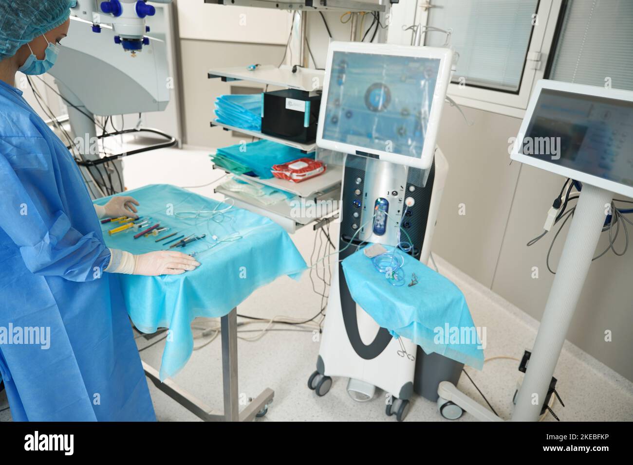 Female nurse preparing equipment for surgery in hospital Stock Photo ...