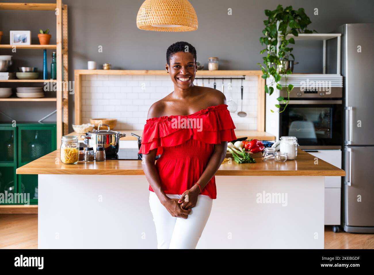 Happy beautiful hispanic south american and black women meeting indoors ...