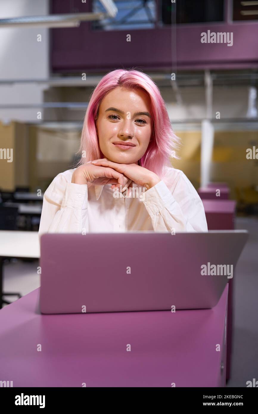 Designer sitting in coworking space and working online Stock Photo - Alamy