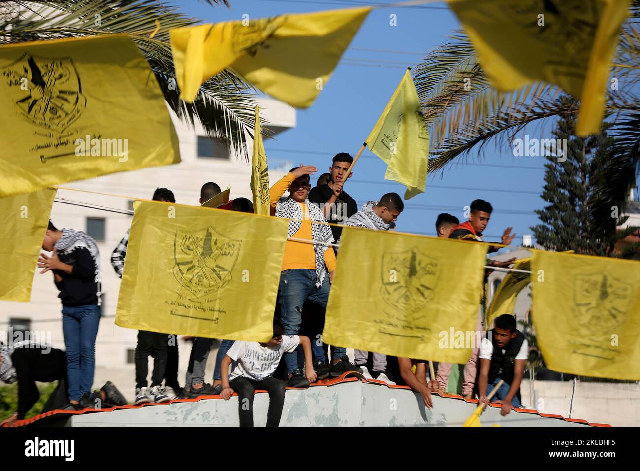 Gaza, Palestine. 10th Nov, 2022. Palestinian children wave yellow flags ...