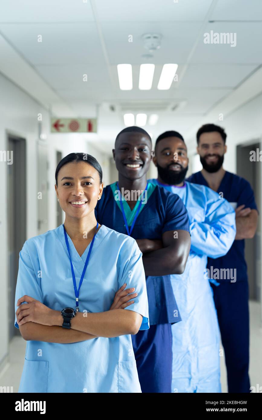 Vertical portrait of diverse group of smiling healthcare workers in ...