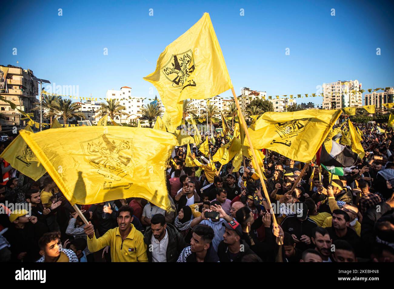 Palestinian supporters of the Palestinian Fatah movement wave yellow ...