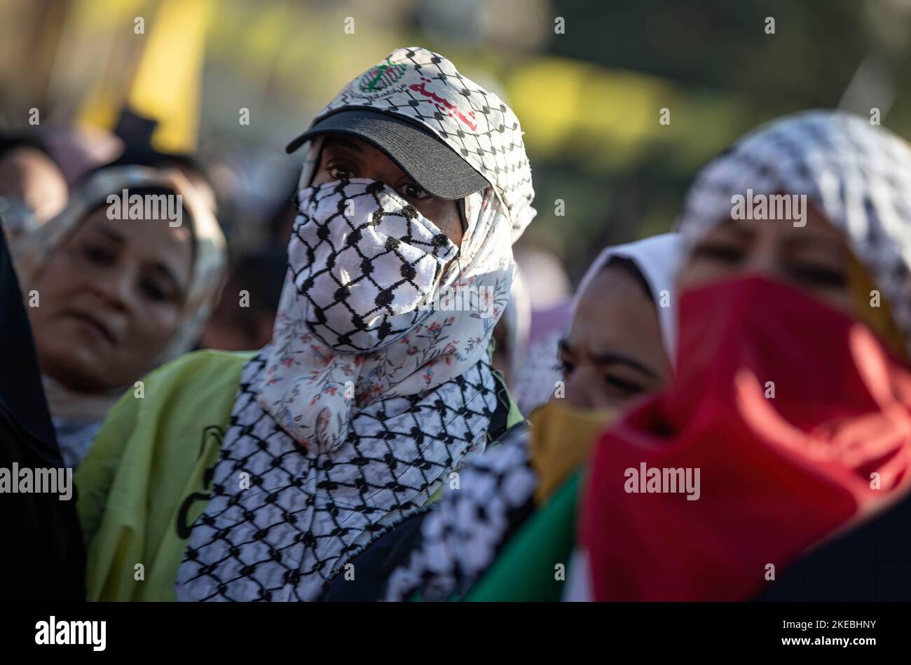 A Palestinian woman wears the Palestinian keffiyeh during a celebration ...