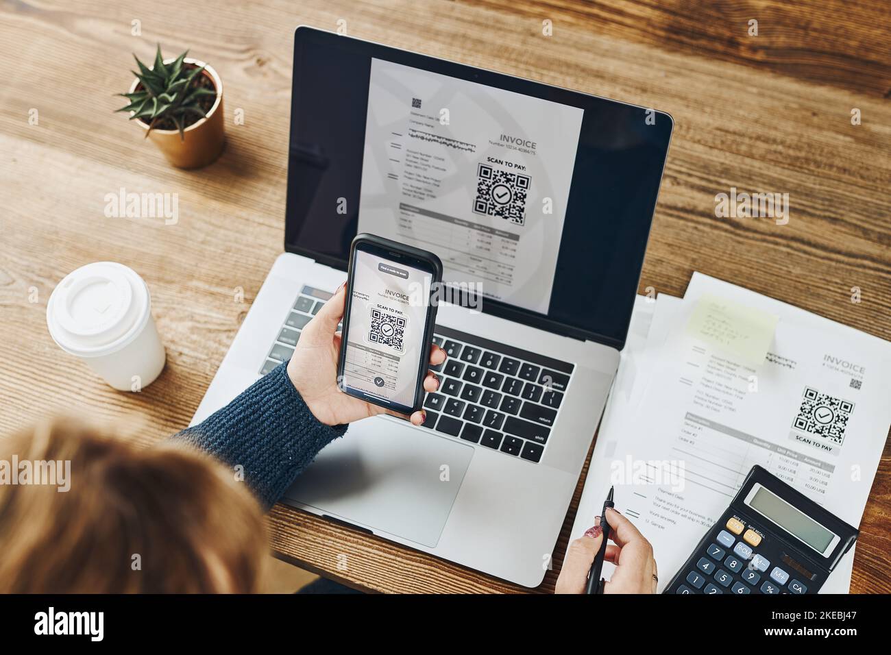 Woman scanning QR code from invoice to make payment using fast secure ...