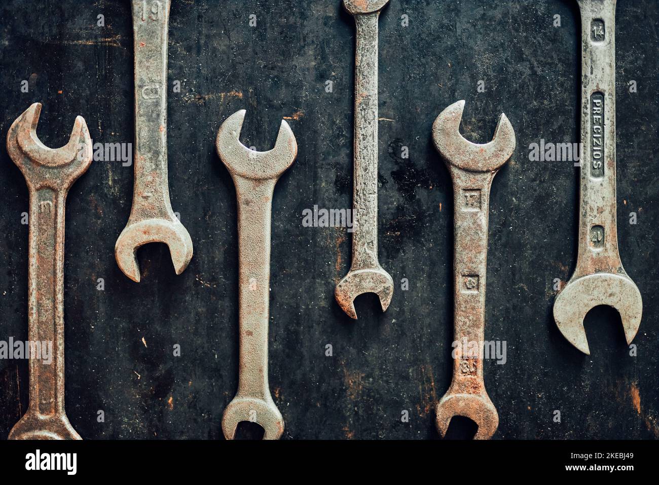Spanners on steel surface. Old rusty wrenches for maintenance. Mechanic ...