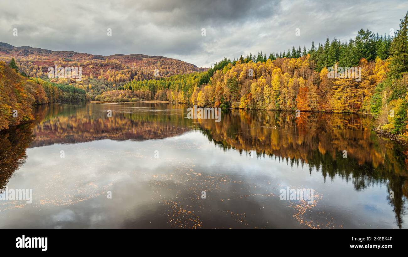 Loch Faskally autumn colours in ScotlandWater Stock Photo - Alamy