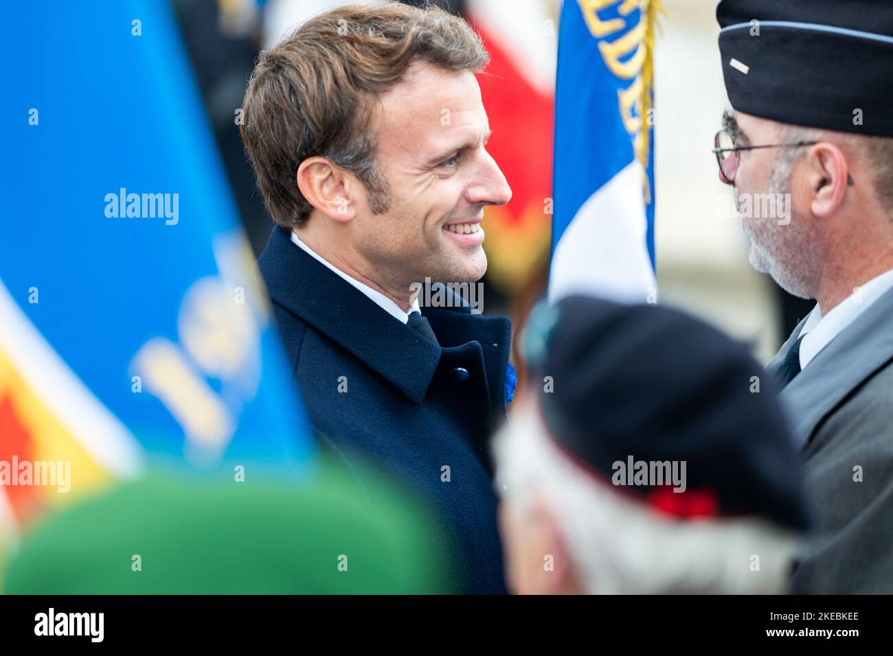 French President Emmanuel Macron lays a wreath of flowers during a ...