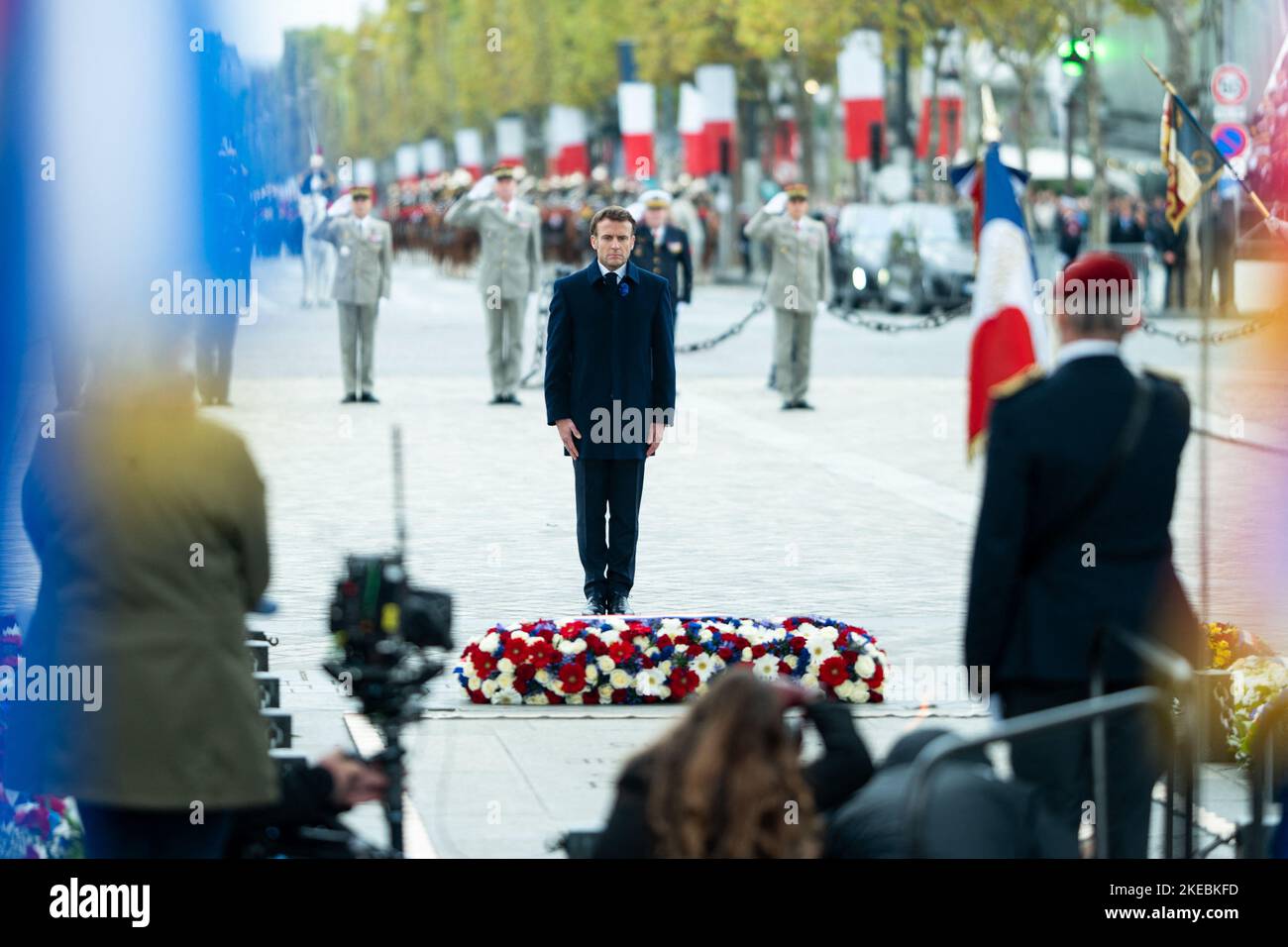 French President Emmanuel Macron lays a wreath of flowers during a ...