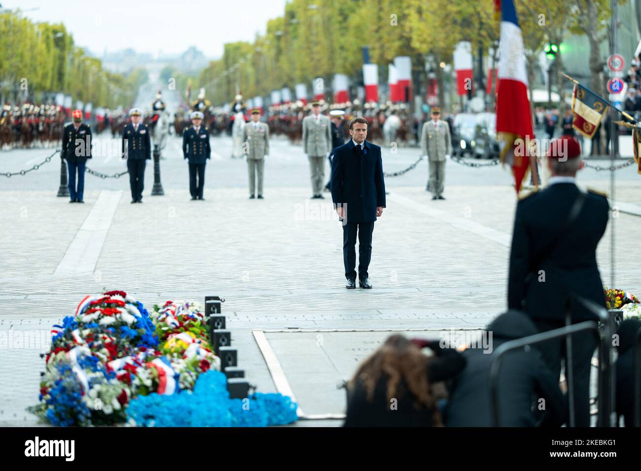 French President Emmanuel Macron lays a wreath of flowers during a ...