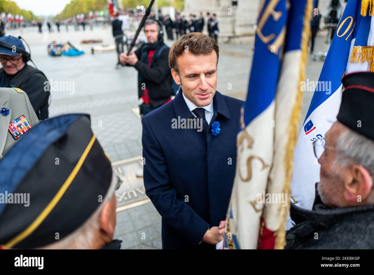French President Emmanuel Macron lays a wreath of flowers during a ...