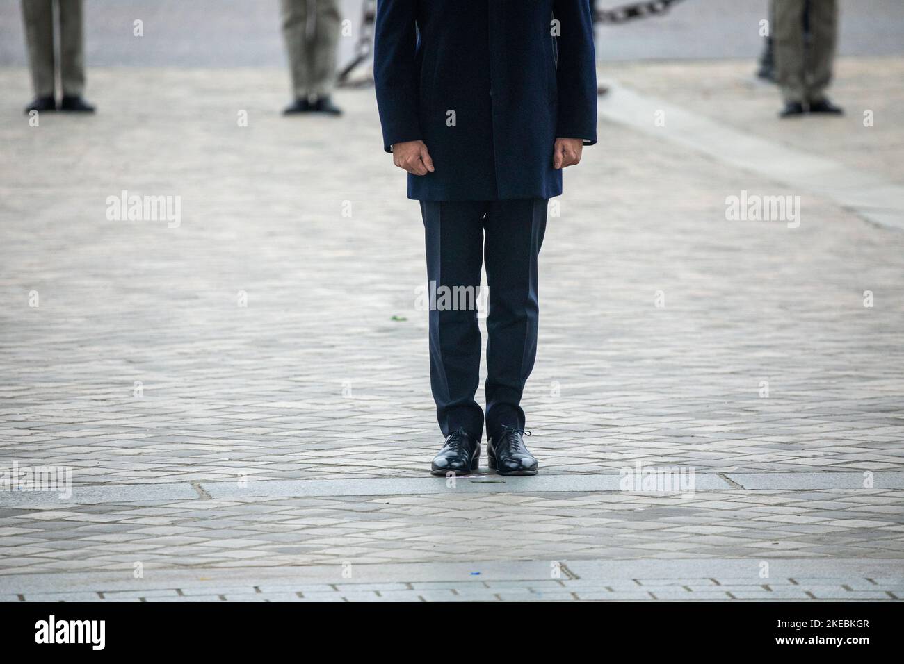 French President Emmanuel Macron lays a wreath of flowers during a ...