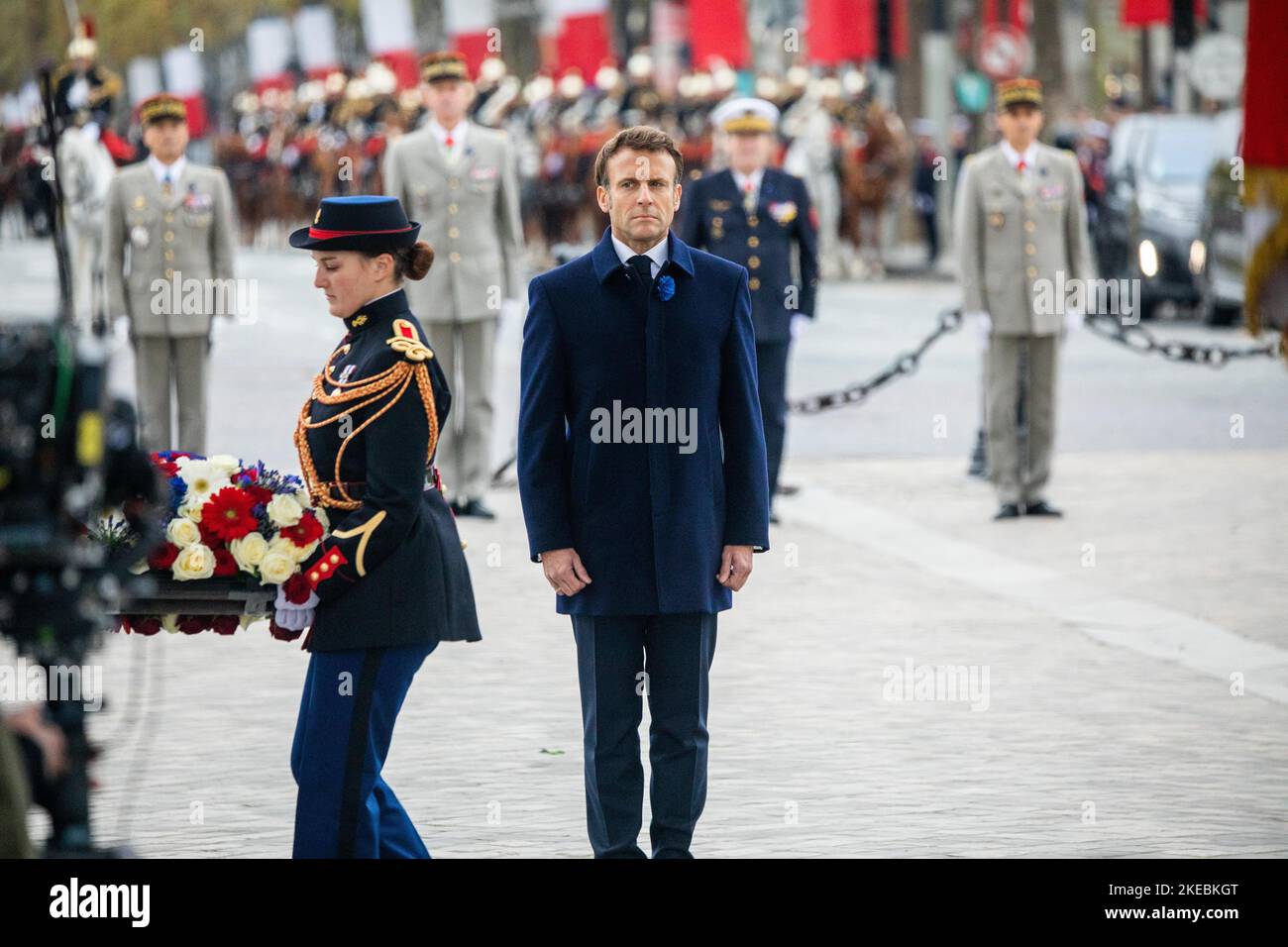 French President Emmanuel Macron lays a wreath of flowers during a ...