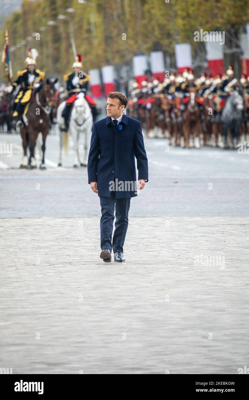 French President Emmanuel Macron lays a wreath of flowers during a ...