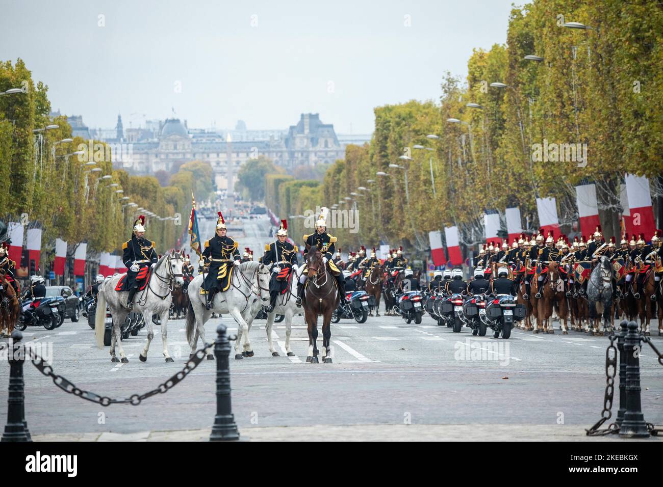 French President Emmanuel Macron lays a wreath of flowers during a ...