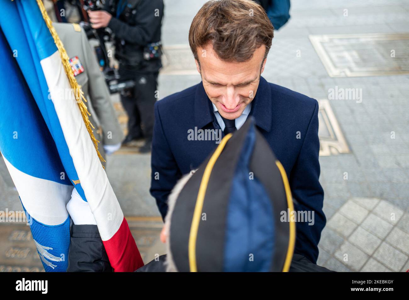 French President Emmanuel Macron lays a wreath of flowers during a ...