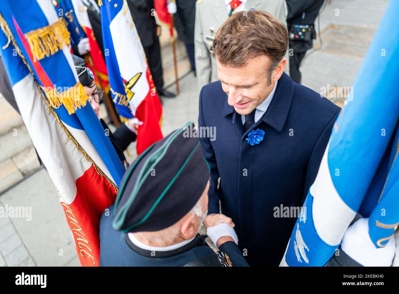 French President Emmanuel Macron lays a wreath of flowers during a ...