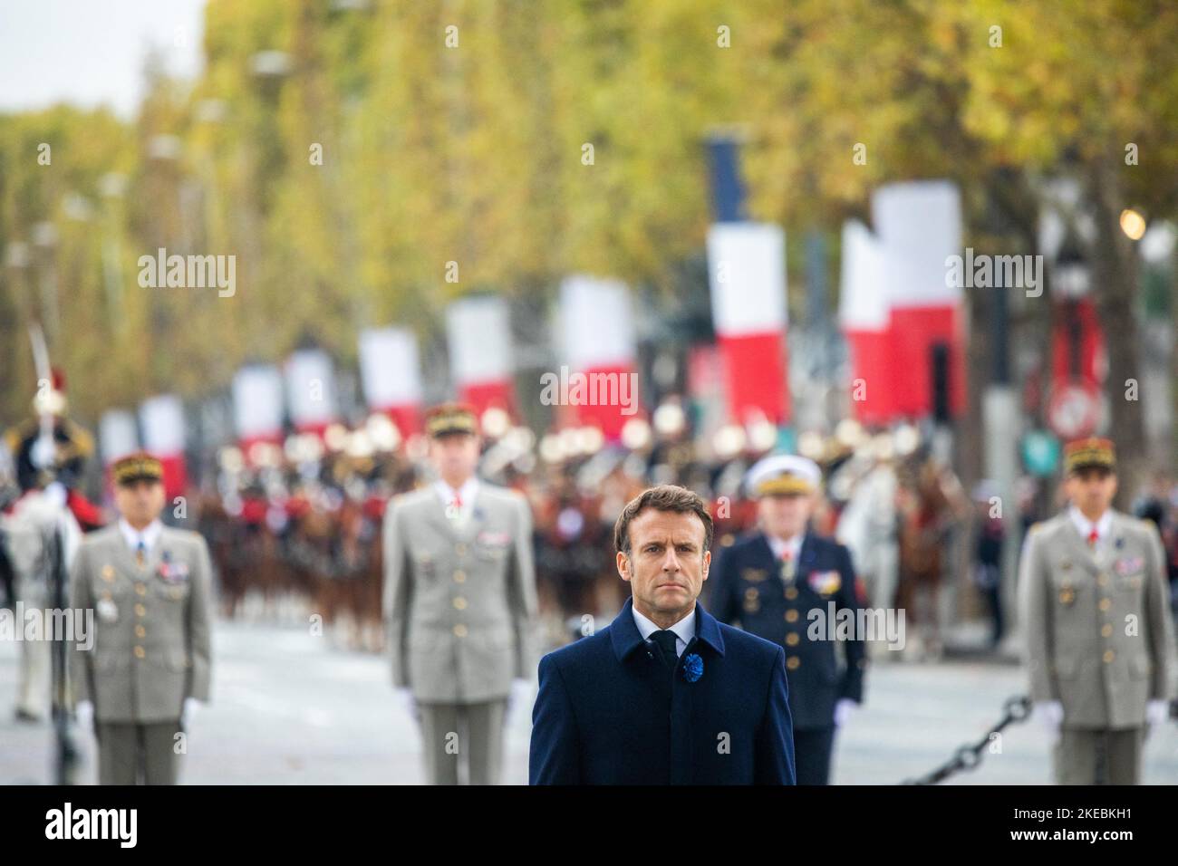 French President Emmanuel Macron lays a wreath of flowers during a ...
