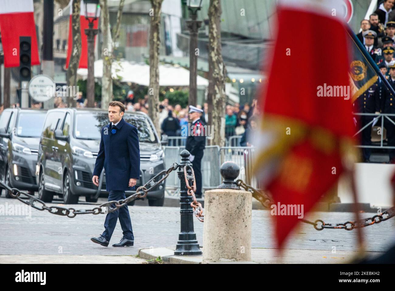 French President Emmanuel Macron lays a wreath of flowers during a ...