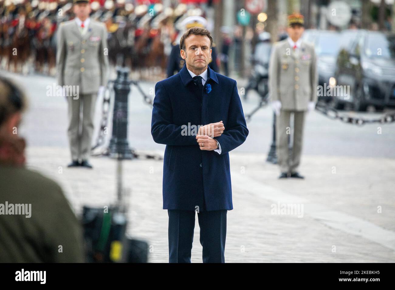 French President Emmanuel Macron lays a wreath of flowers during a ...