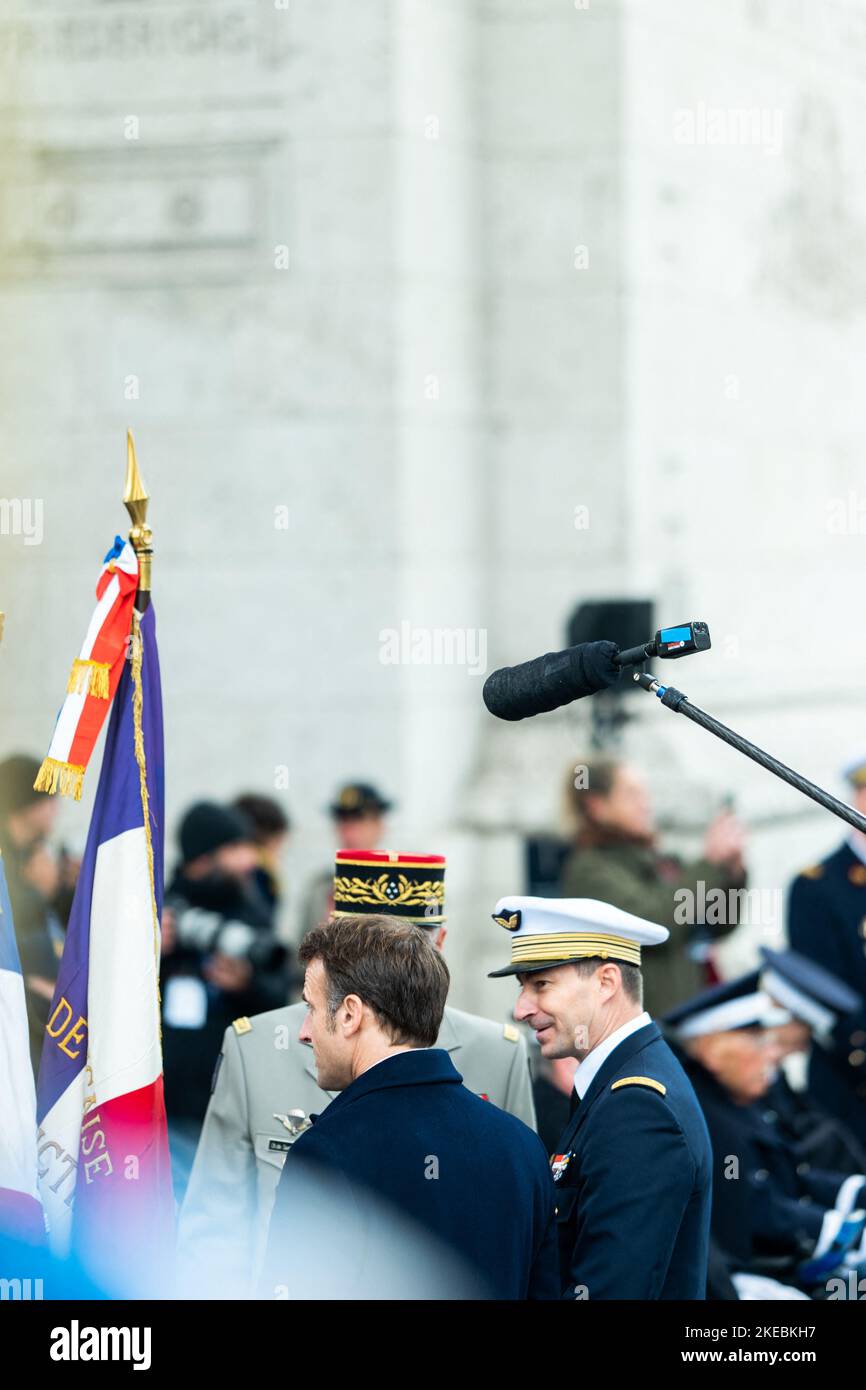 French President Emmanuel Macron lays a wreath of flowers during a ...
