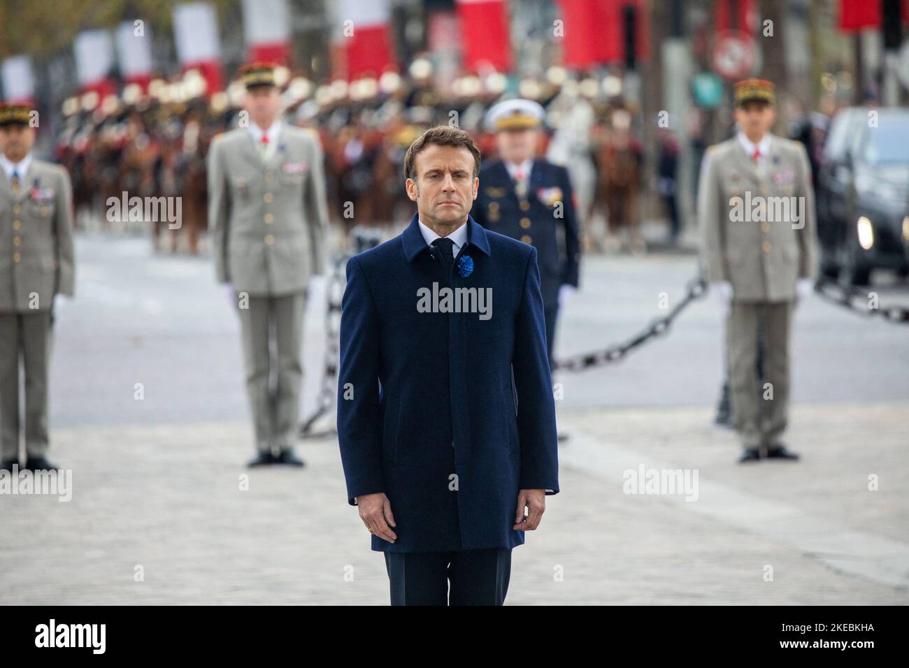 French President Emmanuel Macron lays a wreath of flowers during a ...