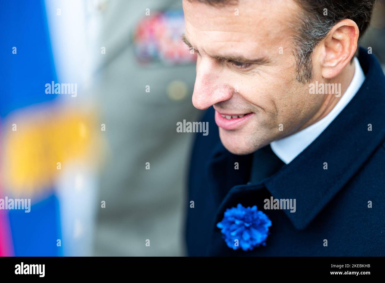 French President Emmanuel Macron lays a wreath of flowers during a ...