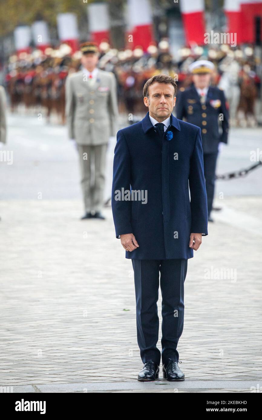 French President Emmanuel Macron lays a wreath of flowers during a ...