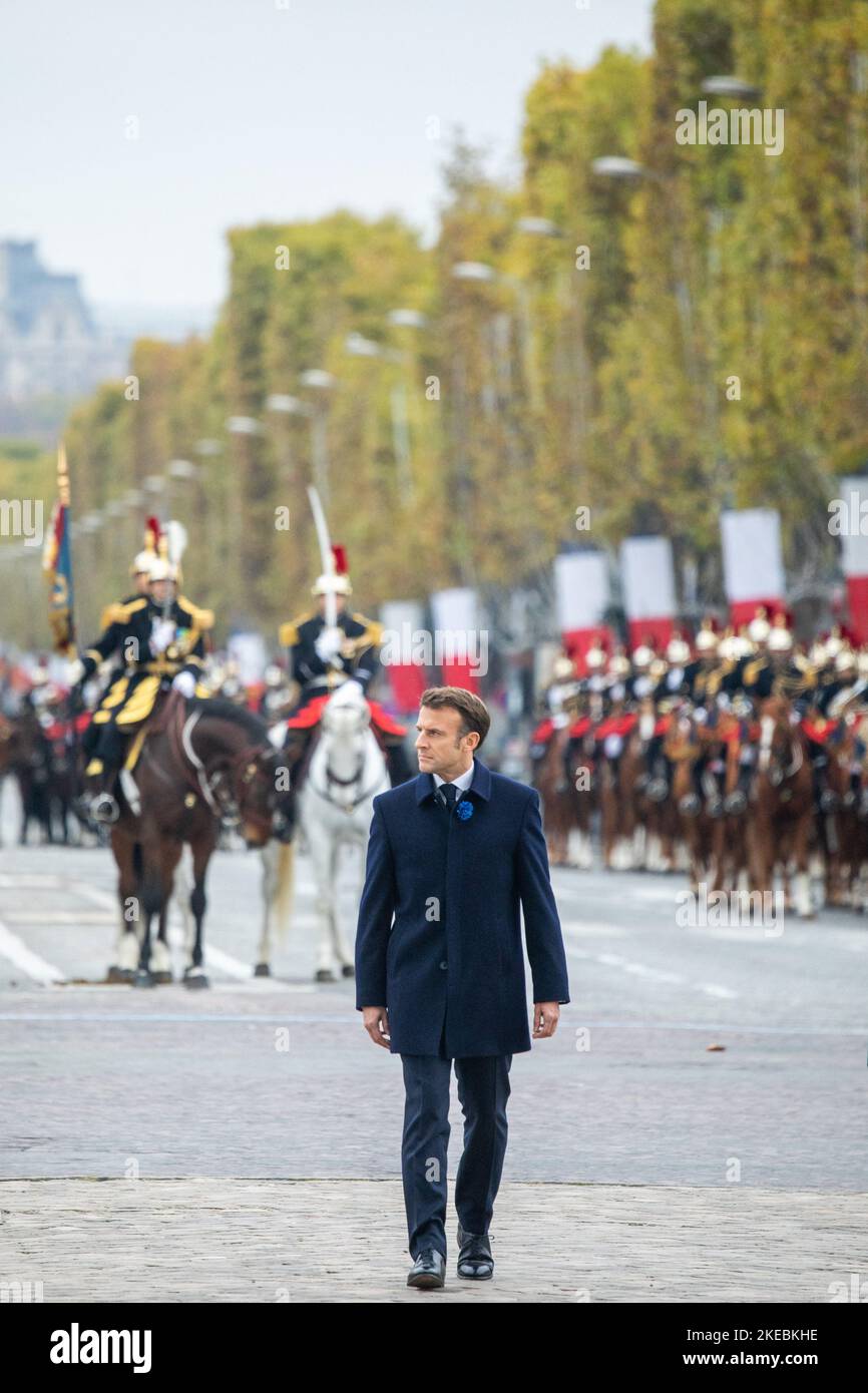 French President Emmanuel Macron lays a wreath of flowers during a ...
