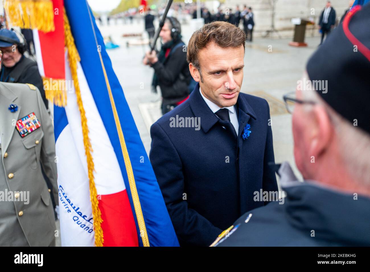 French President Emmanuel Macron lays a wreath of flowers during a ...