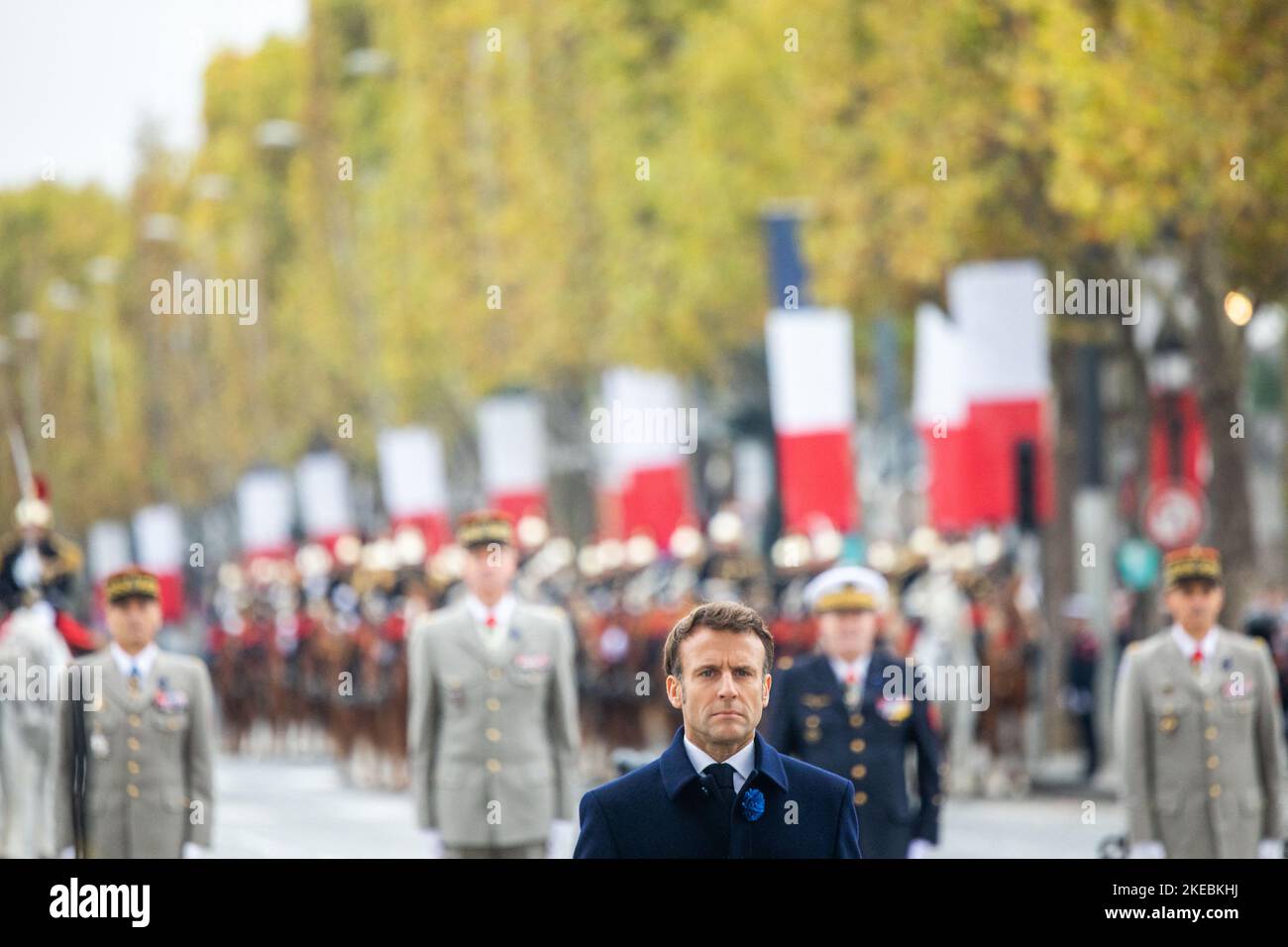 French President Emmanuel Macron lays a wreath of flowers during a ...
