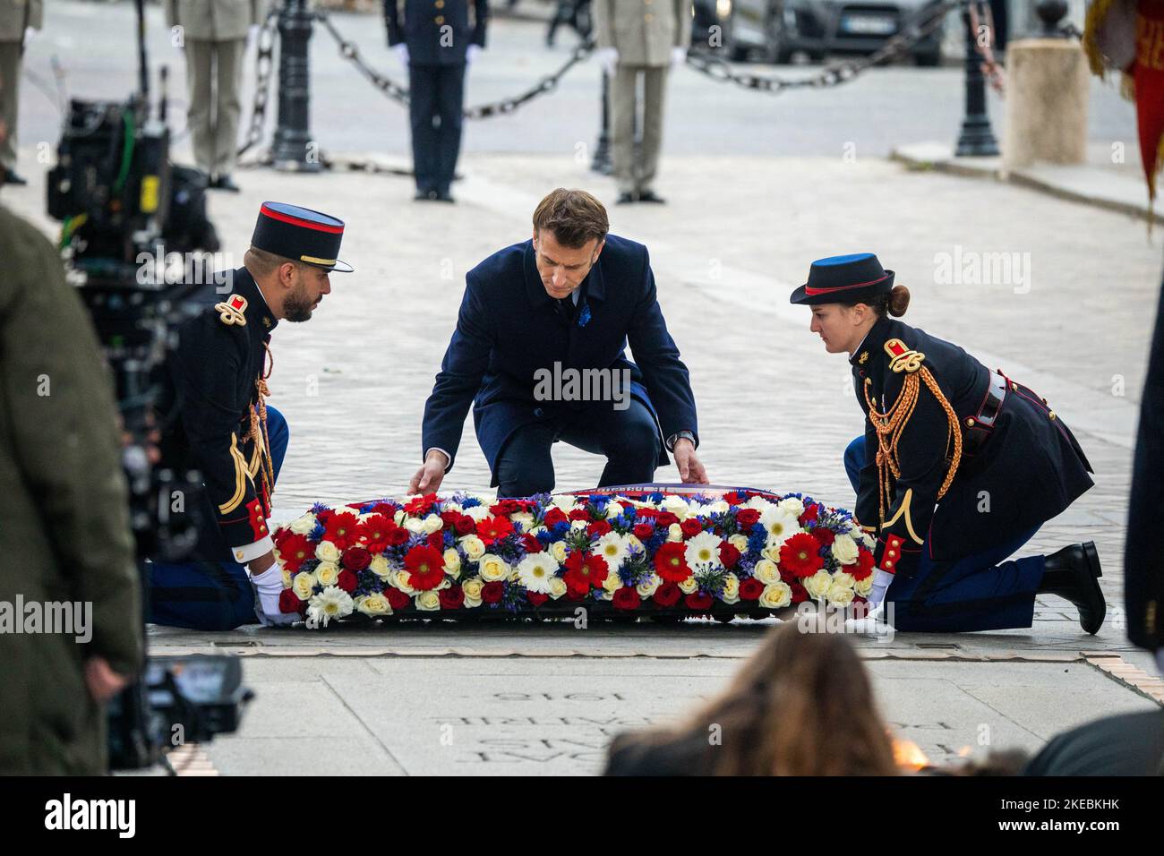 French President Emmanuel Macron lays a wreath of flowers during a ...