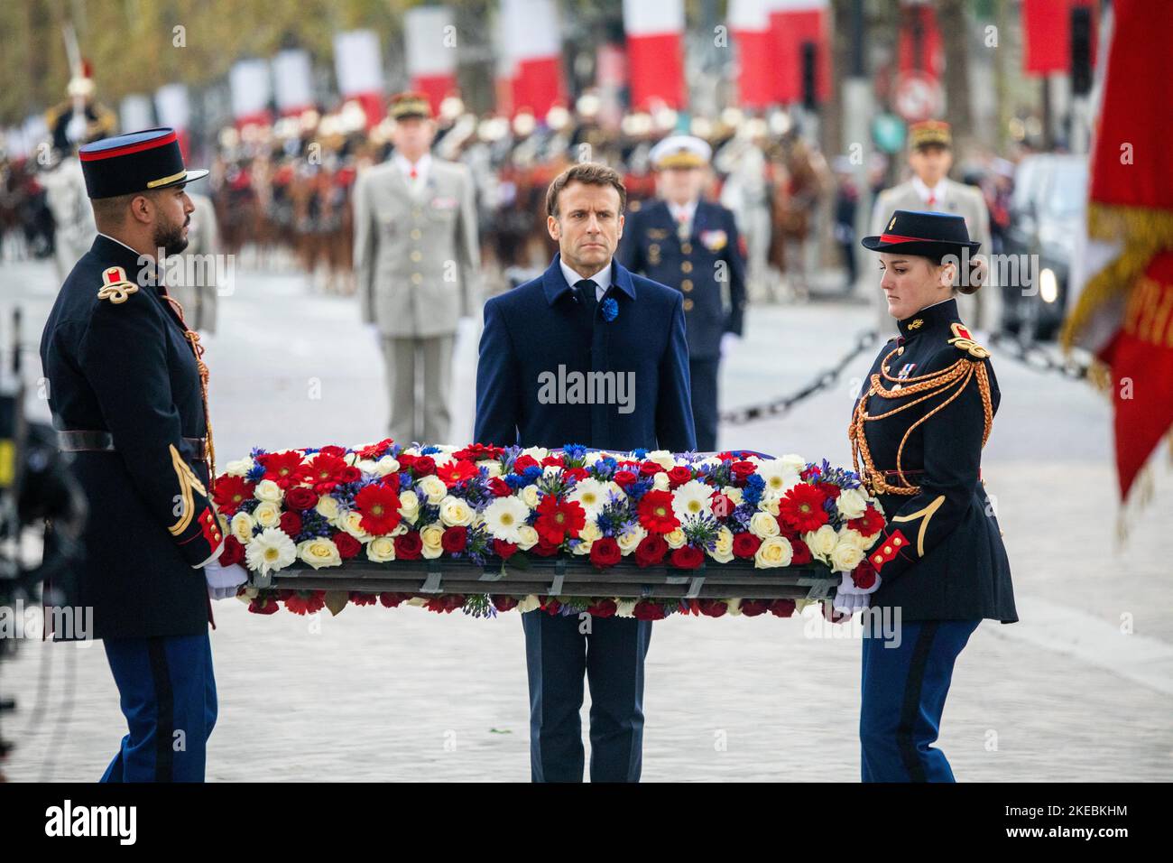 French President Emmanuel Macron lays a wreath of flowers during a ...