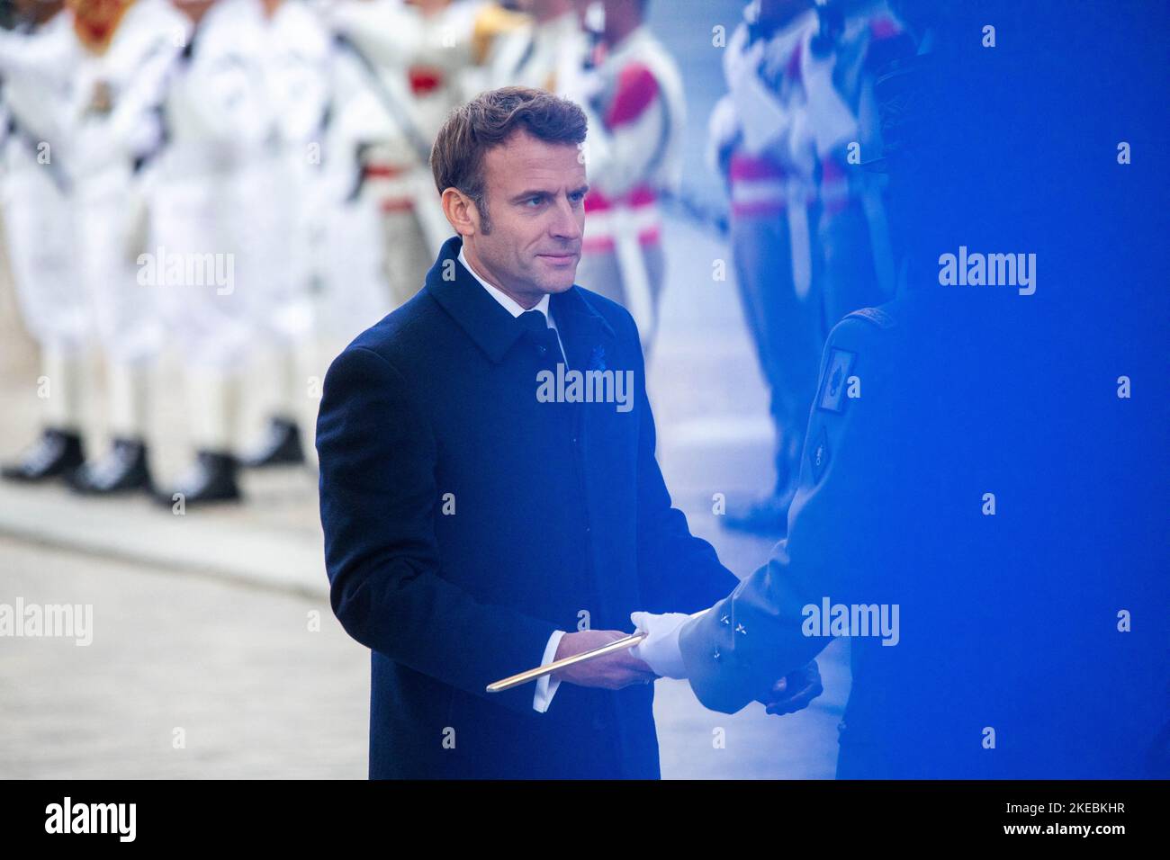 French President Emmanuel Macron lays a wreath of flowers during a ...