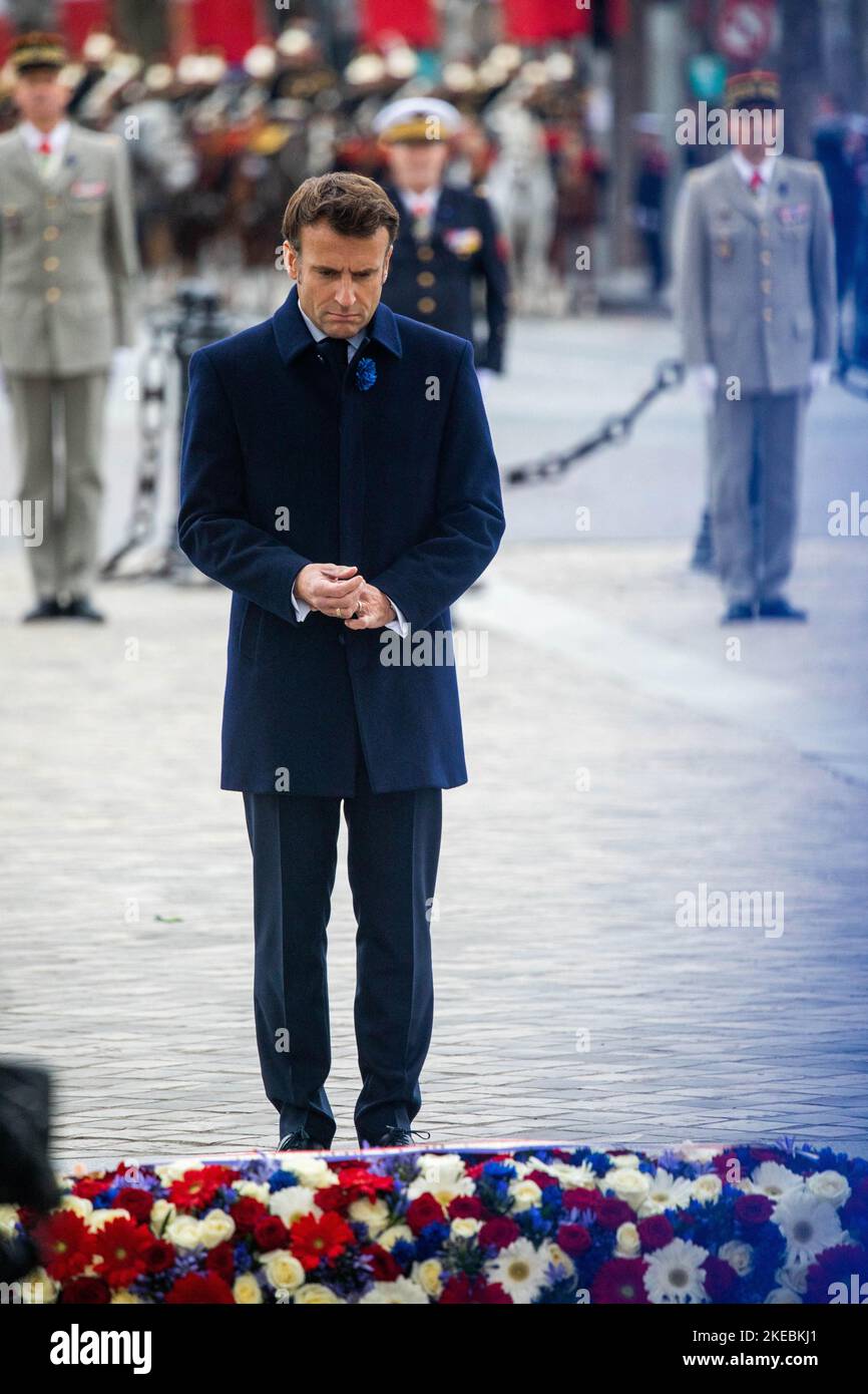 French President Emmanuel Macron lays a wreath of flowers during a ...