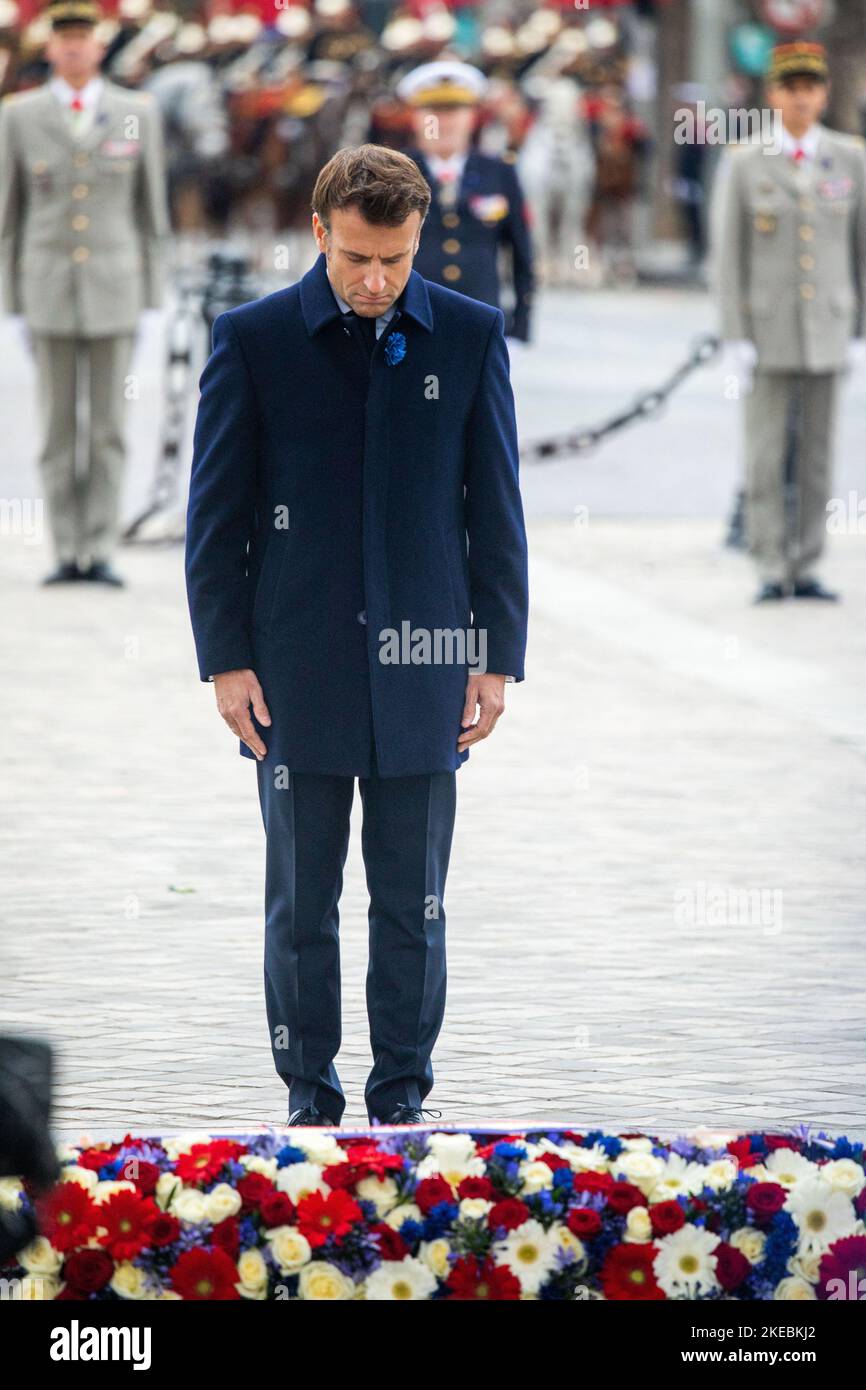 French President Emmanuel Macron lays a wreath of flowers during a ...